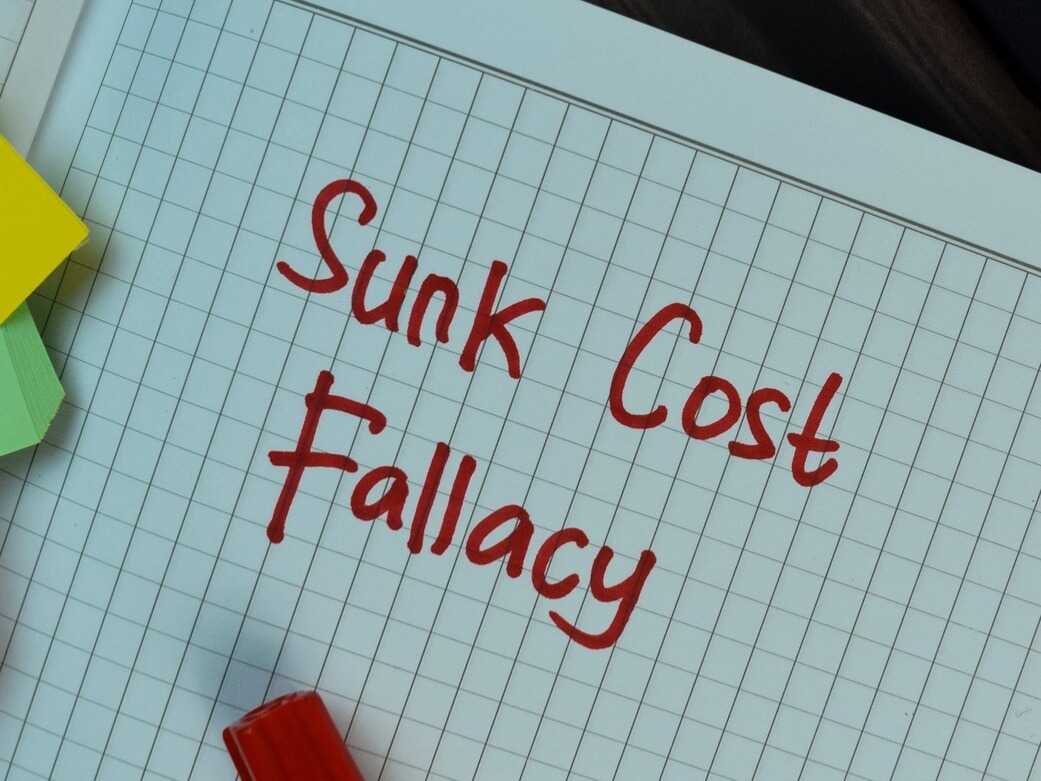 What is the sunk cost fallacy in investing?